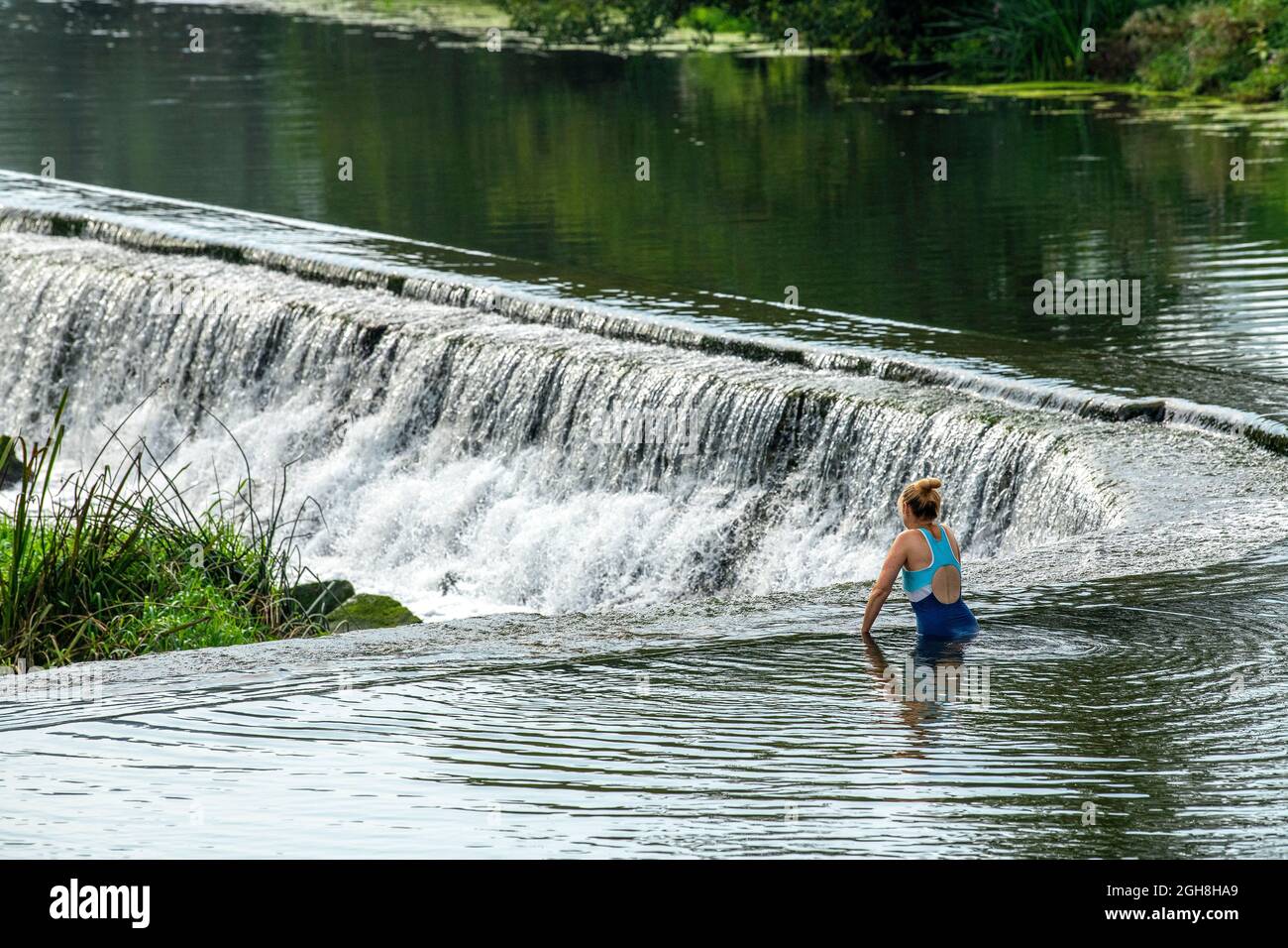 People enjoy the water at Warleigh Weir on the River Avon near Bath in ...