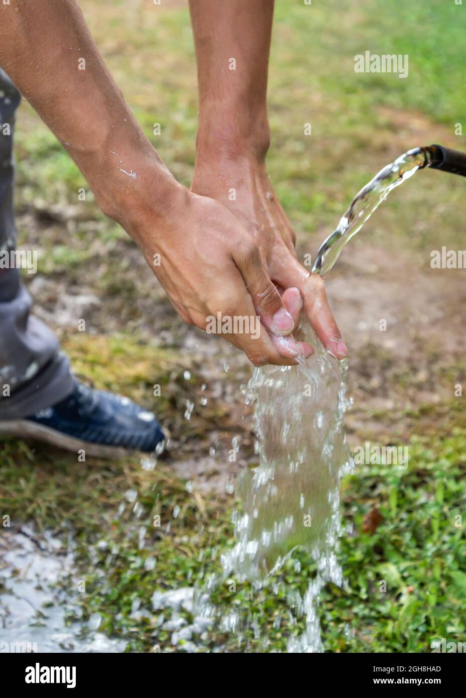 Man washing hands outdoor in countryside Stock Photo - Alamy