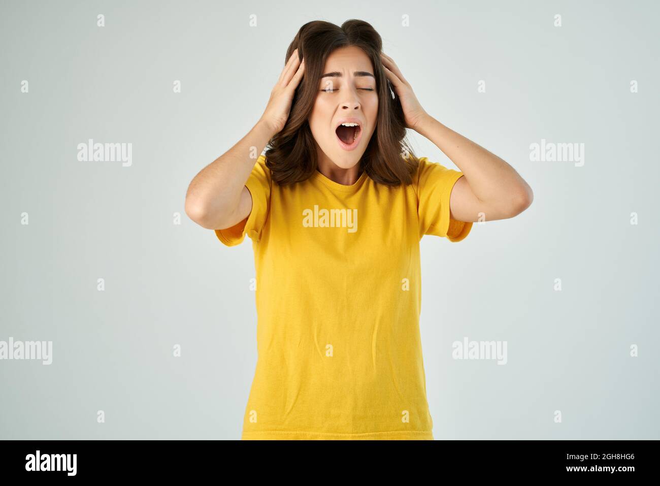 shocked woman covering her face with hand open mouth emotions cropped ...