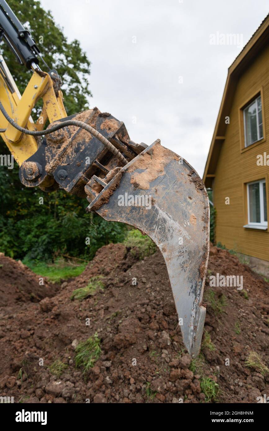 Excavator is working in countryside Stock Photo - Alamy