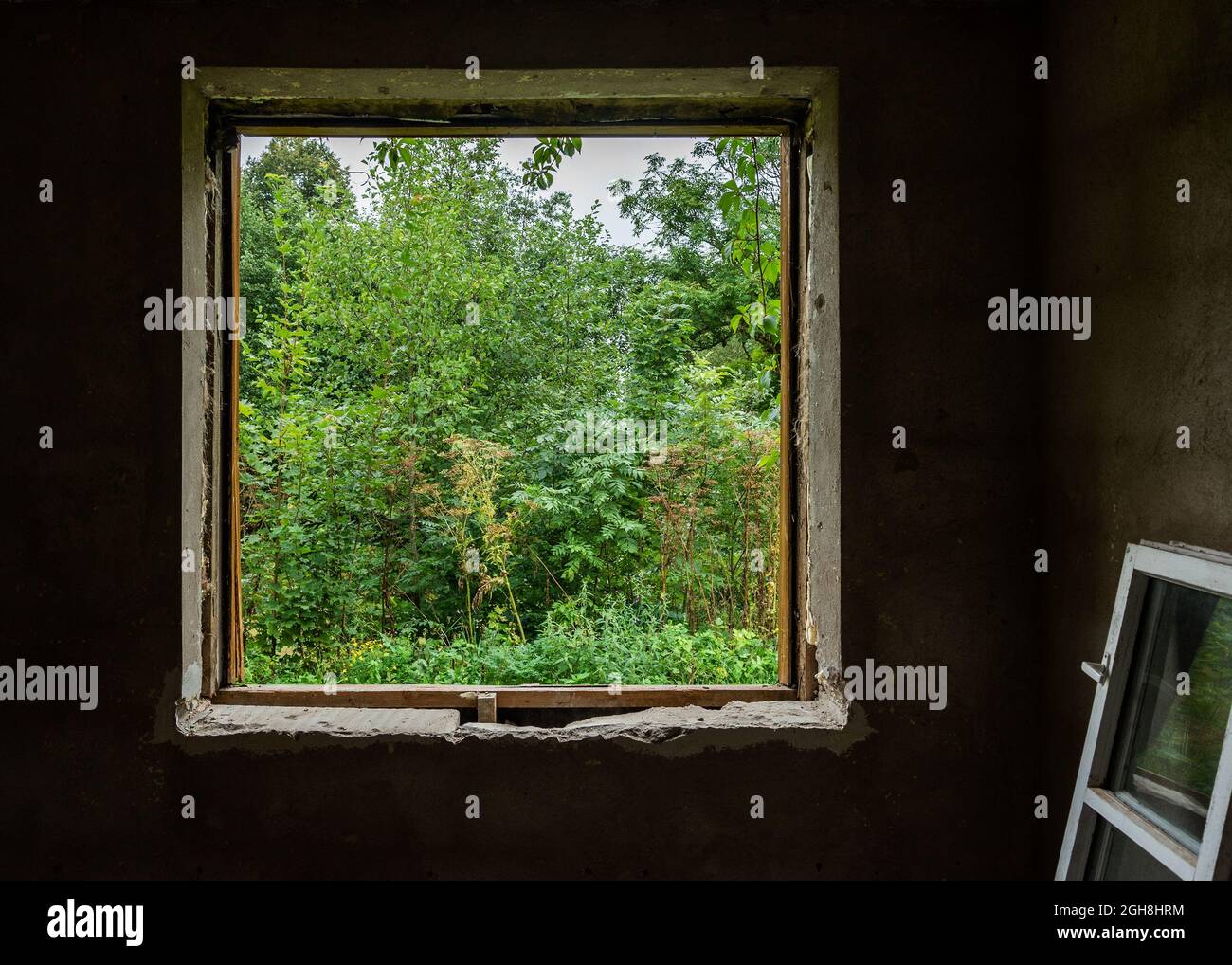 View through window hole from inside of house Stock Photo - Alamy