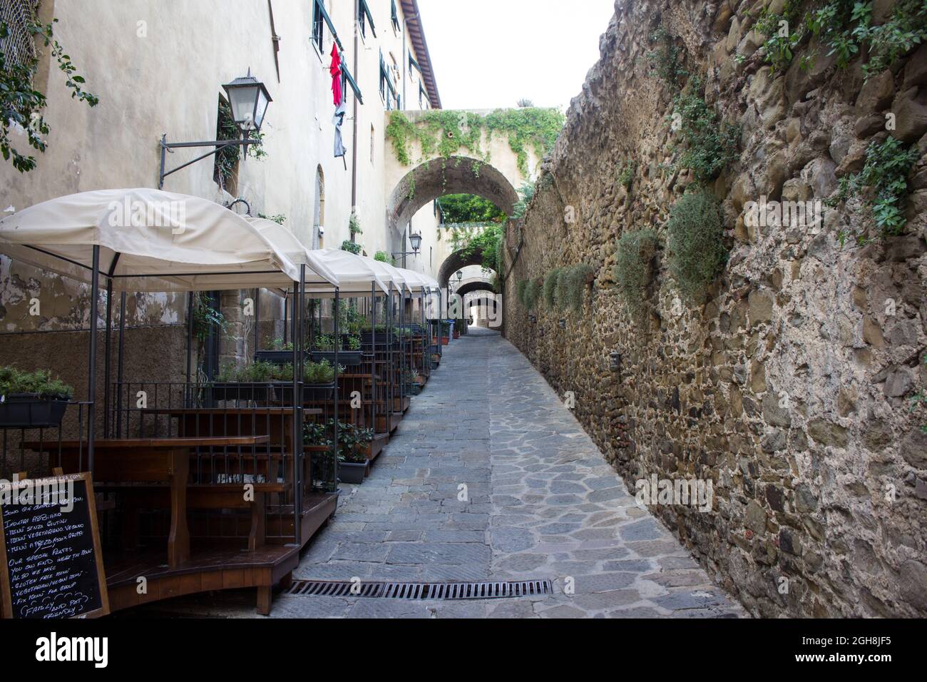 Abandoned remote side street in italian village Stock Photo - Alamy