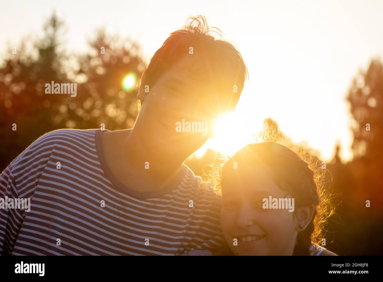 Kid’s couple posing outdoors at sunset Stock Photo - Alamy