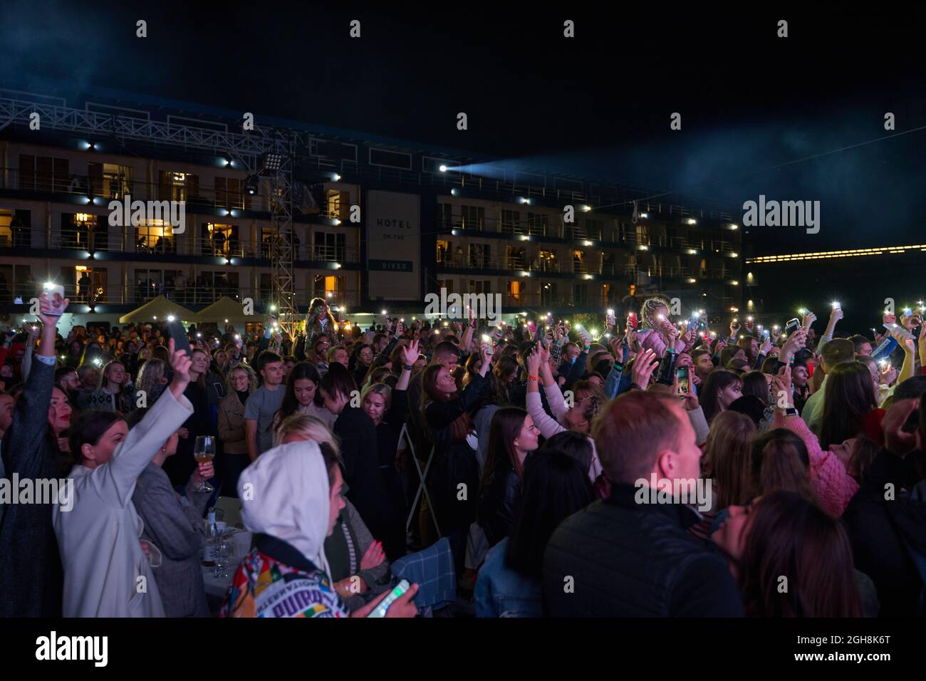 Hand holding phones in crowd hi-res stock photography and images - Alamy