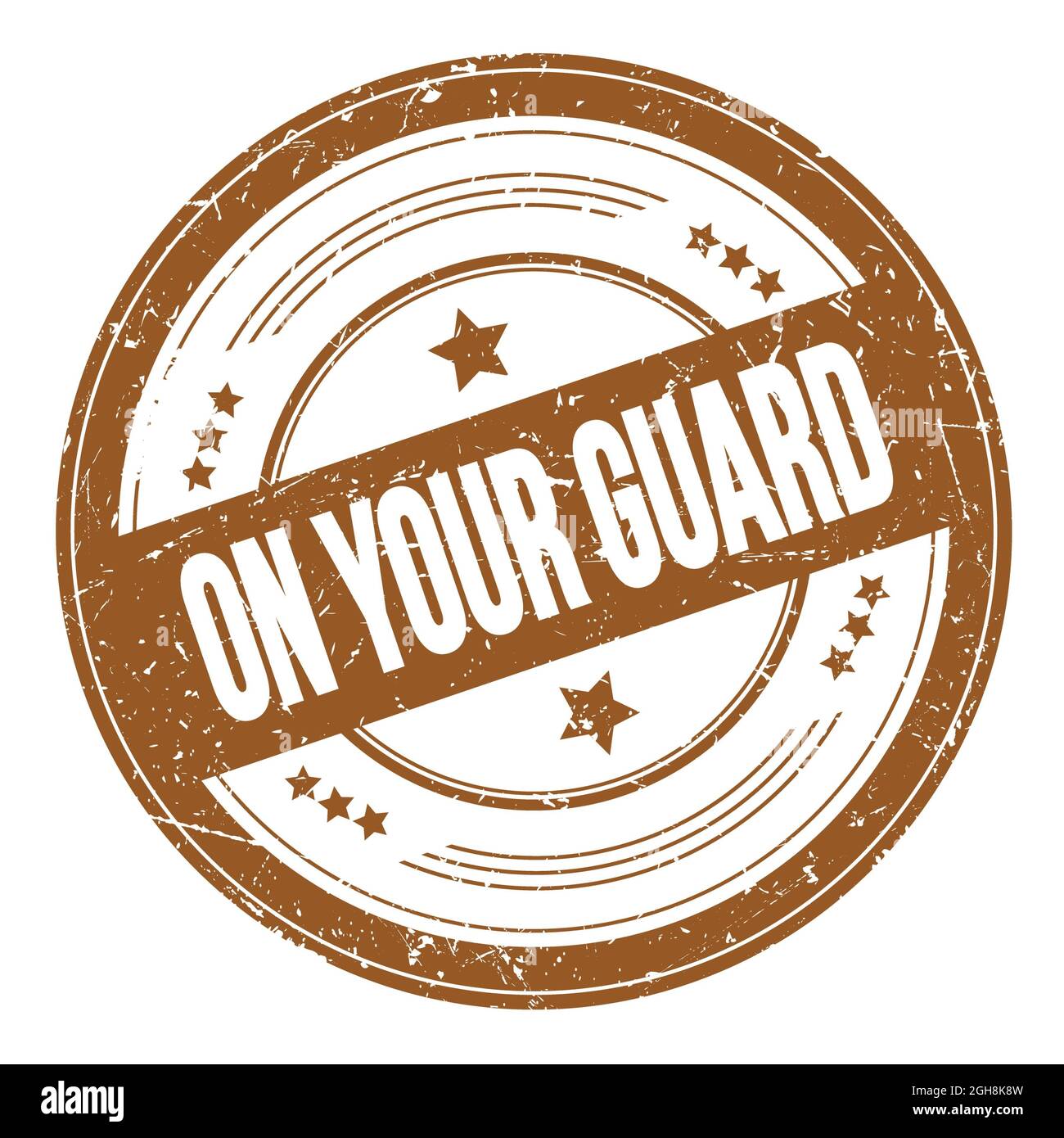 ON YOUR GUARD text on brown round grungy texture stamp Stock Photo - Alamy