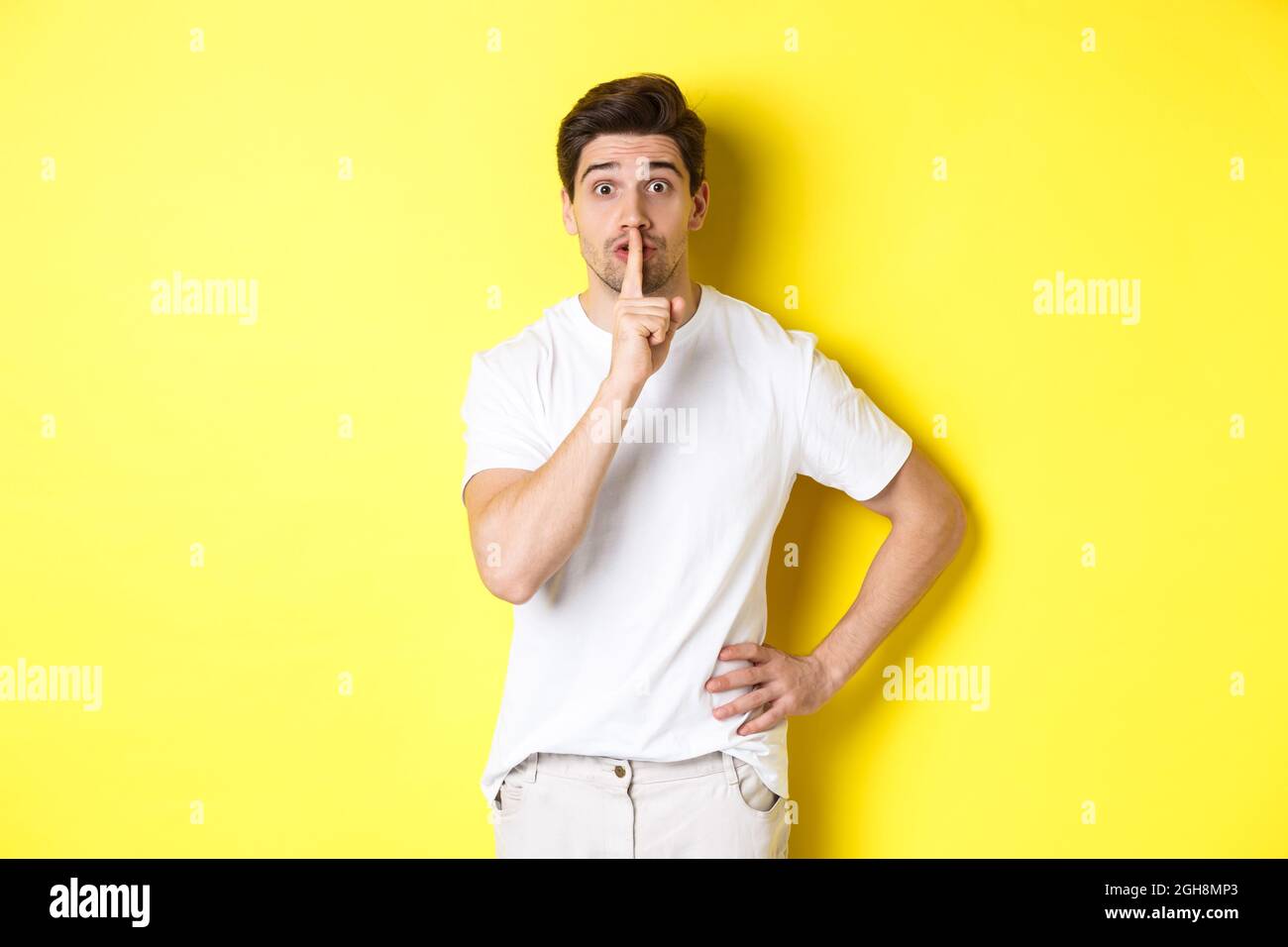 Image of excited guy planning surprise, shushing at camera, press ...
