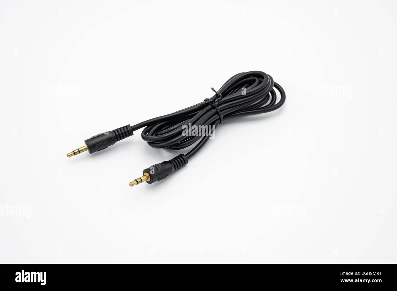 Closeup shot of fixed and tied audio jack isolated on a white ...