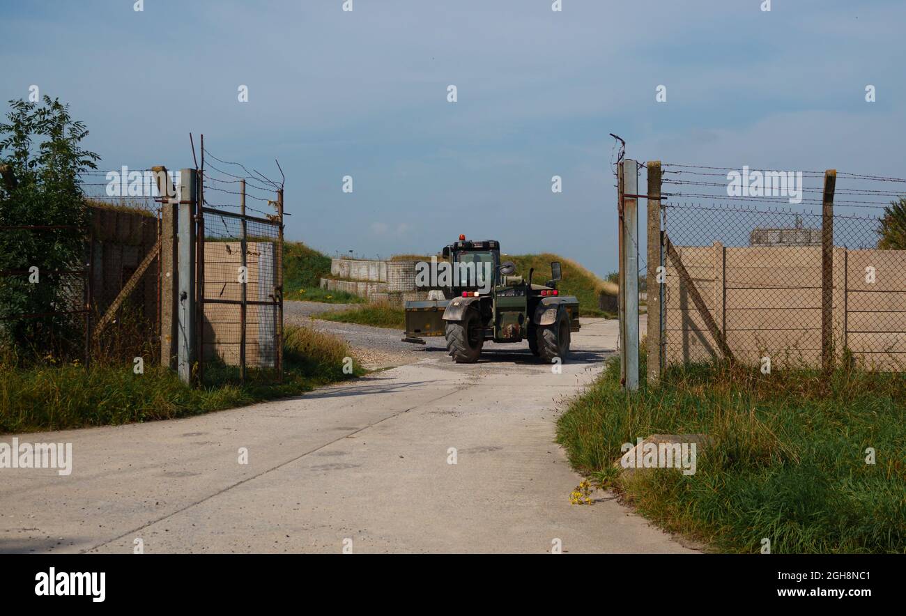 British army JCB fork lift truck moving boxed weapons in preparation ...