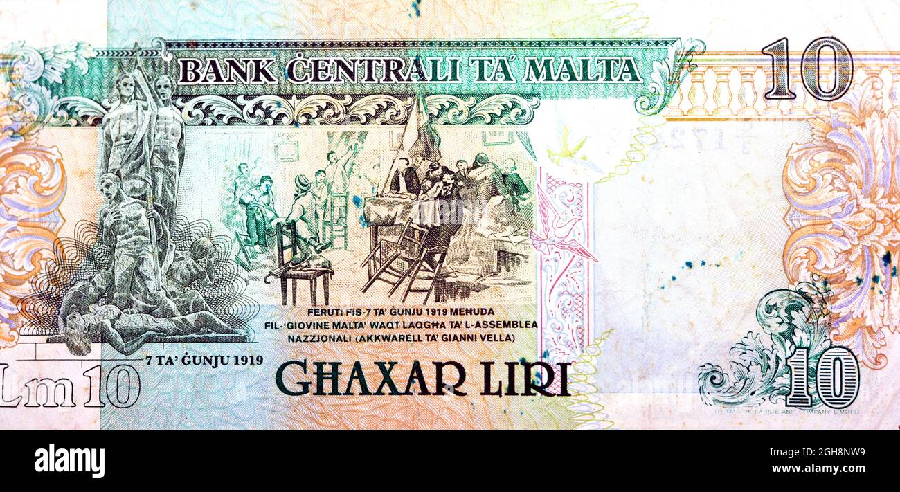 Large part of the reverse side of 10 ten Maltese lira banknote currency ...