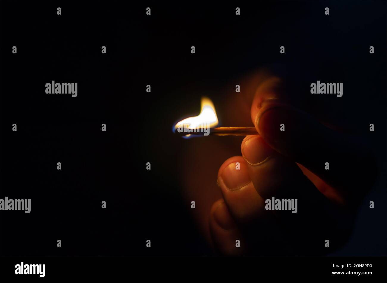 Person holding burning match hi-res stock photography and images - Alamy
