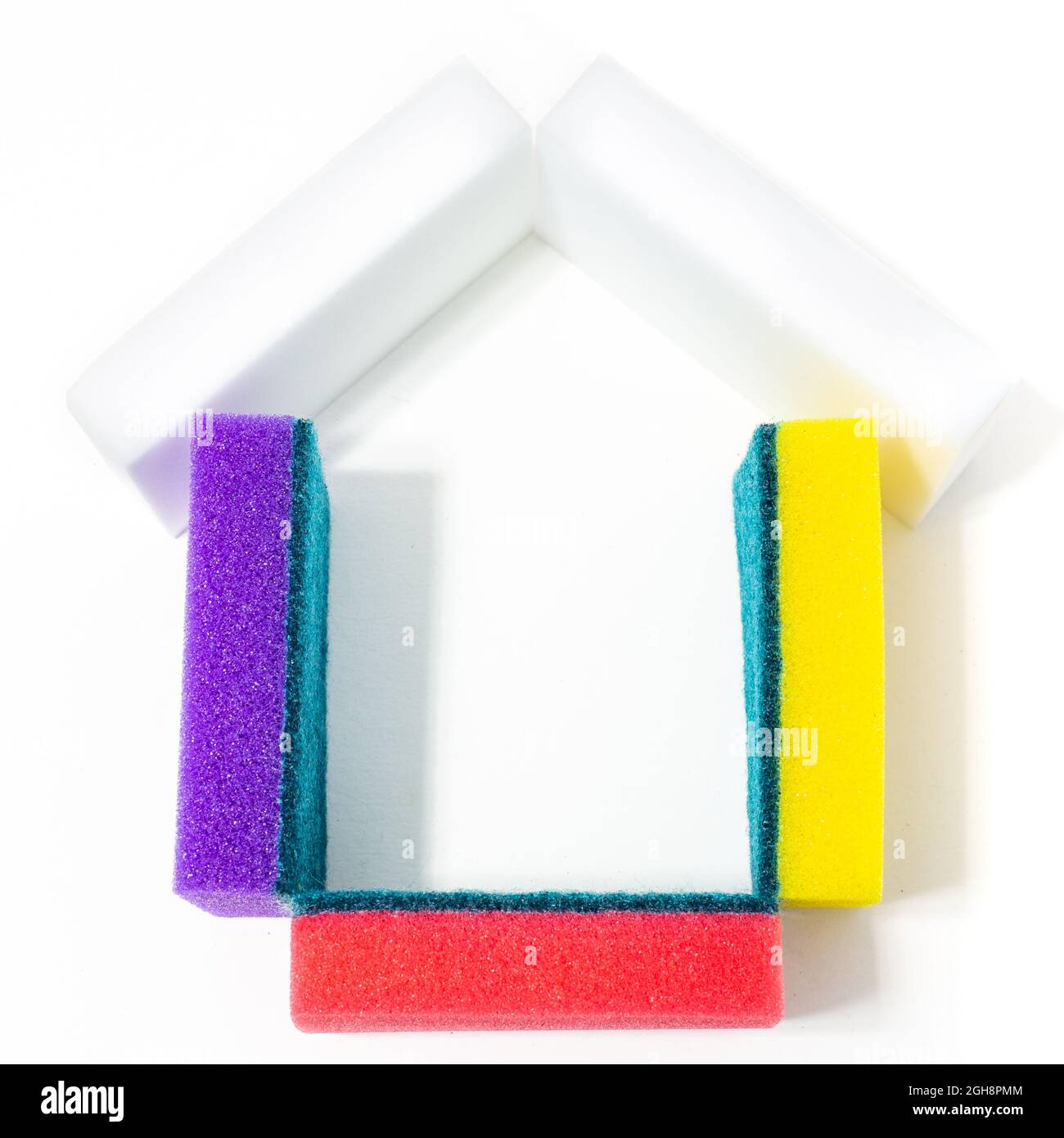 foam sponges for washing dishes folded in the shape of a house with a ...
