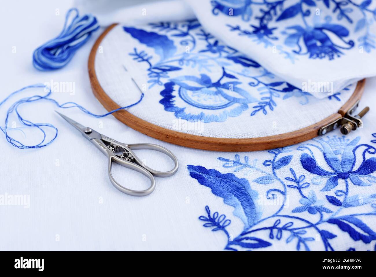 Embroidery hoop with fabric, sewing needle and thread. Handmade ...