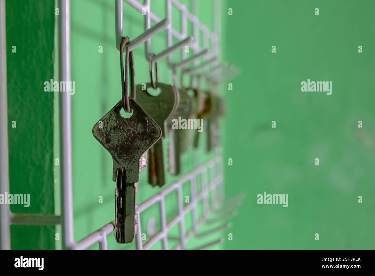 Locks lined up hanging on the wall Stock Photo - Alamy