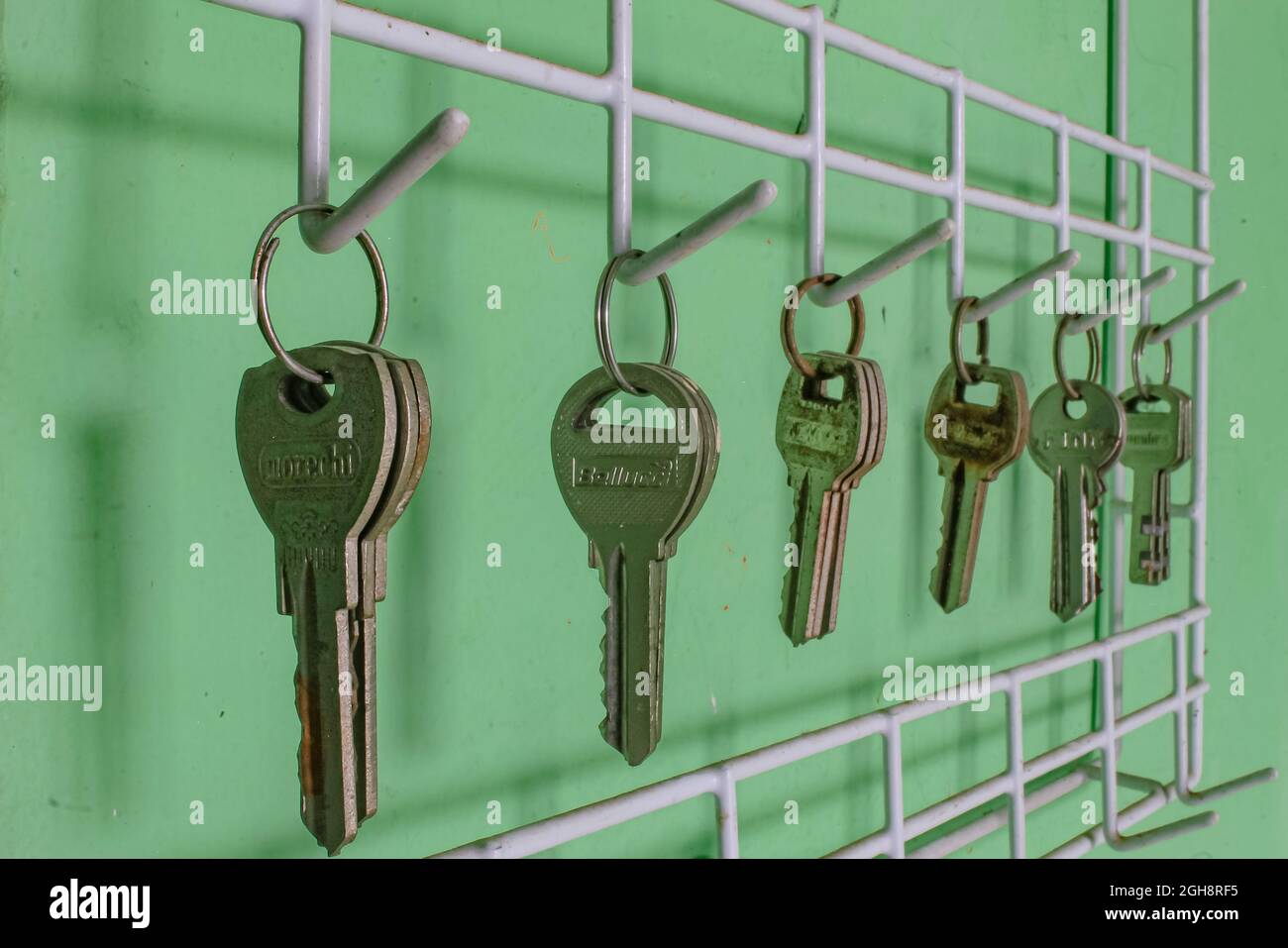 Locks lined up hanging on the wall Stock Photo - Alamy