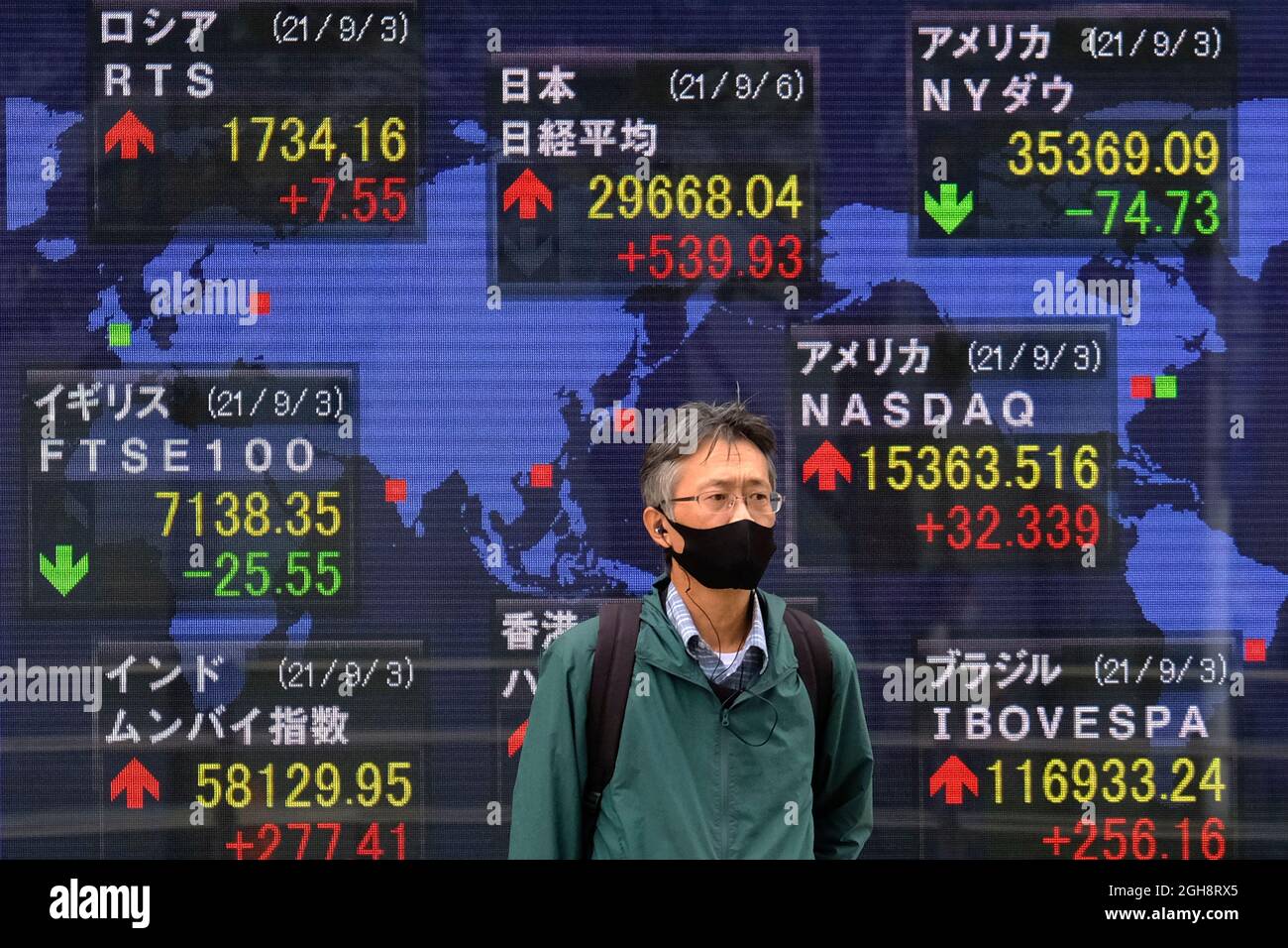 Tokyo, Japan. 06th Sep, 2021. A man wearing a face mask walks past an ...
