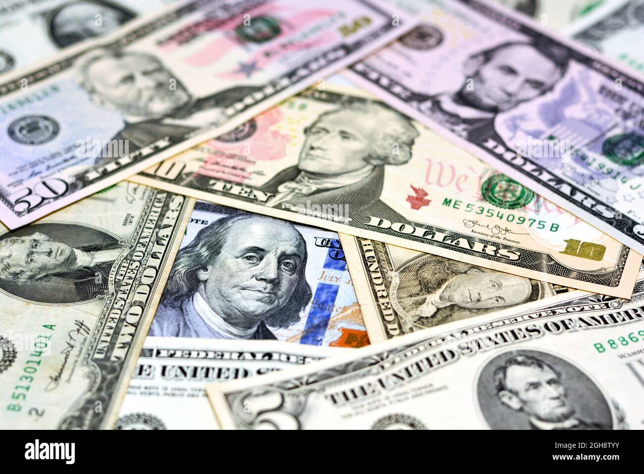 background of American money banknotes of different values and times ...