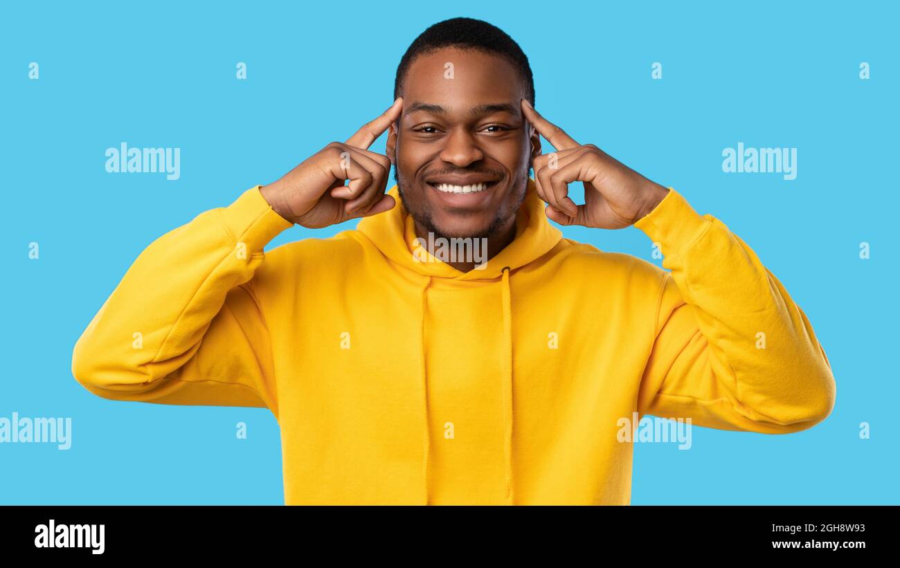 Cheerful African Man Pointing At Forehead Over Blue Background ...