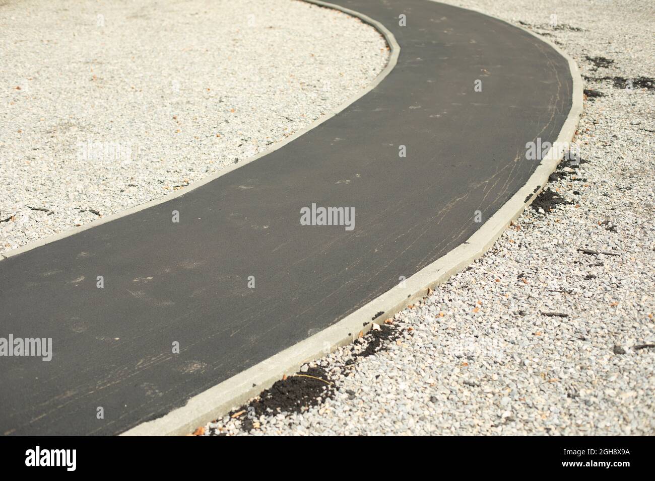 Repaired asphalt road in city hi-res stock photography and images - Alamy