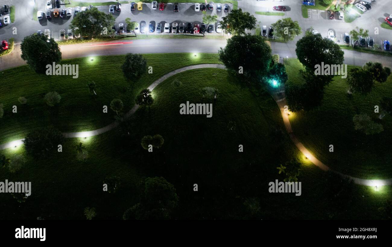 Aerial shot of colorful street lights in a park at night in Florida ...