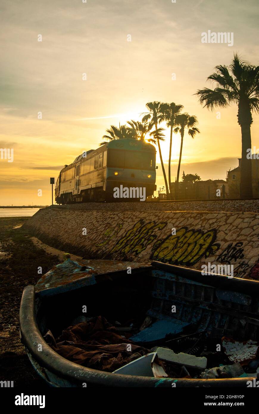 Faro, Portugal - April 12, 2021: Pastel sunset in Faro, train is ...