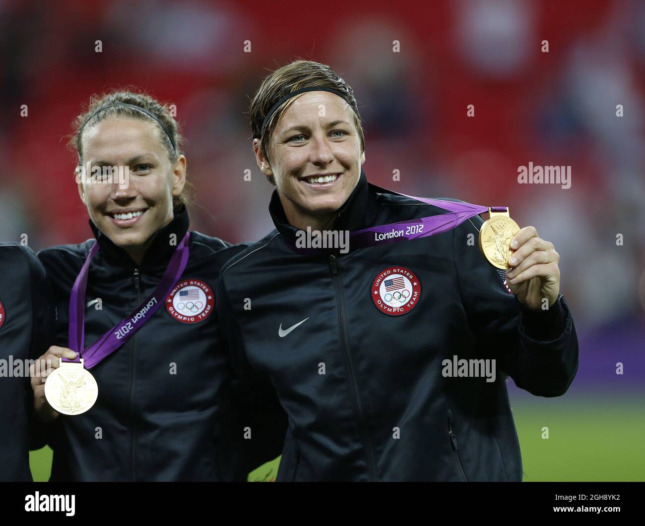 USA's Abby Wambach celebrates with her gold medal during the Womens ...