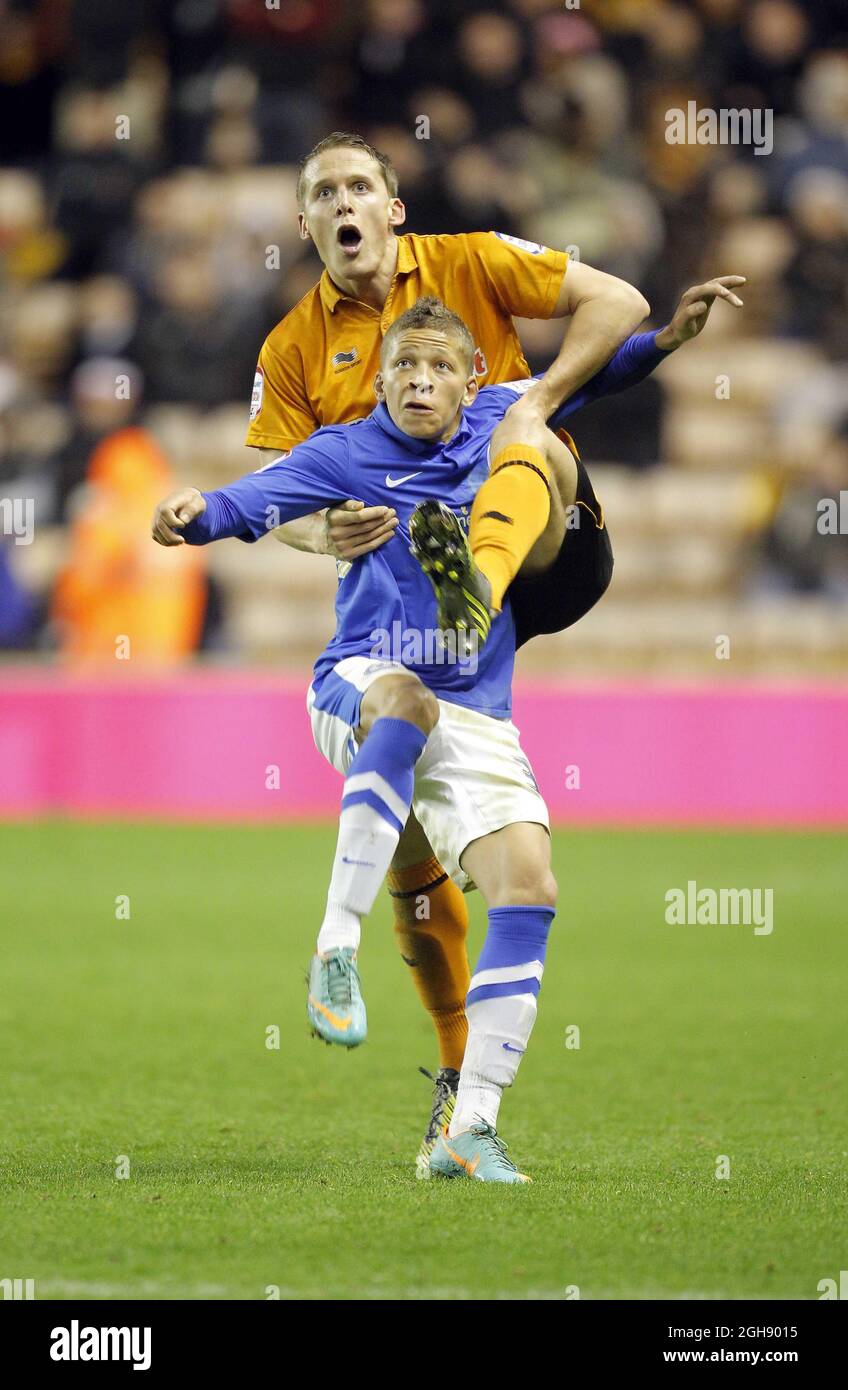 Christophe Berra of Wolves tangles with Dwight Gayle of Peterborough ...