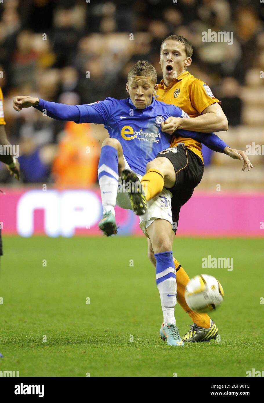 Christophe Berra of Wolves tangles with Dwight Gayle of Peterborough ...