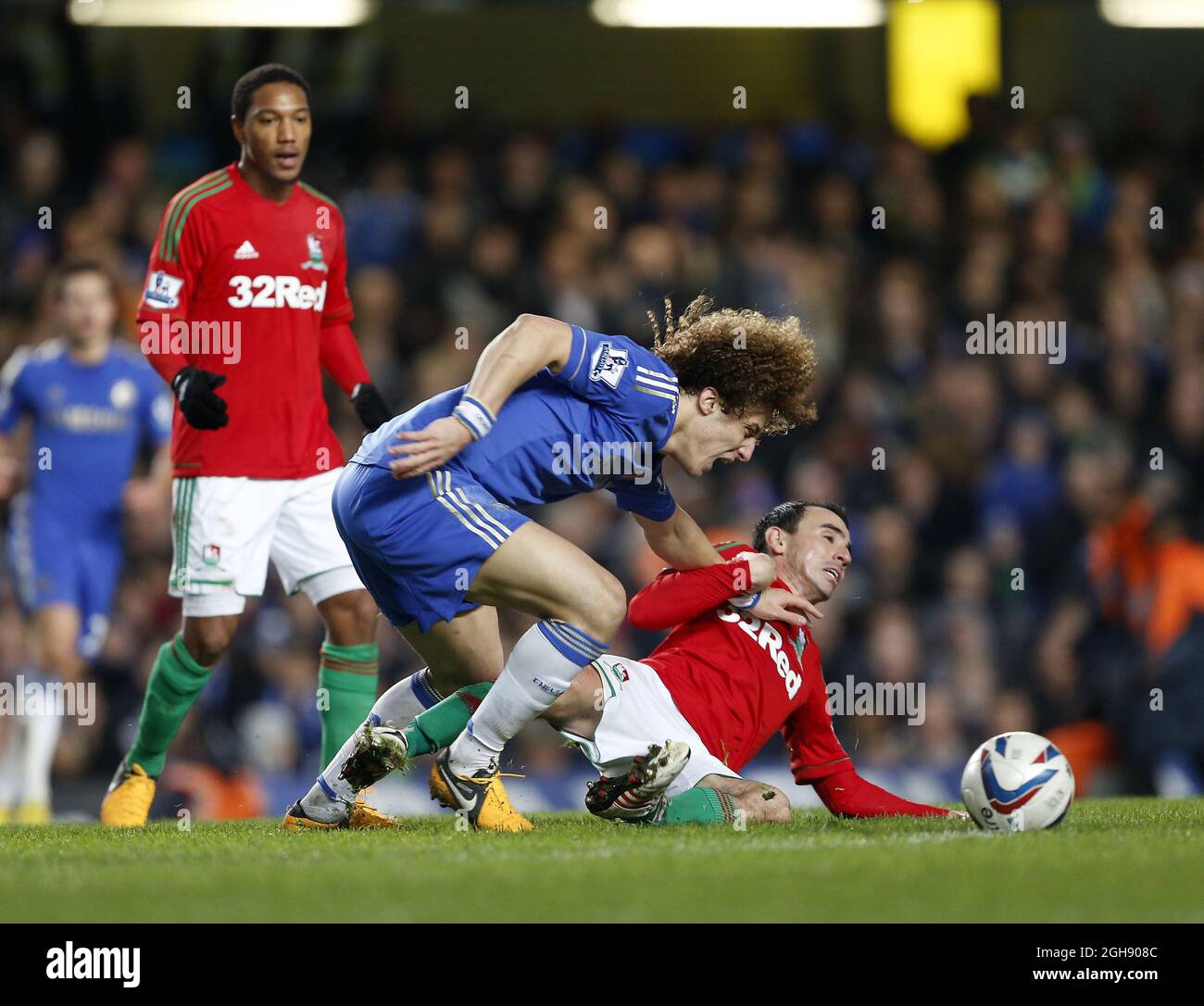 Chelsea's David Luiz tussles with Swansea's Leon Britton during the ...