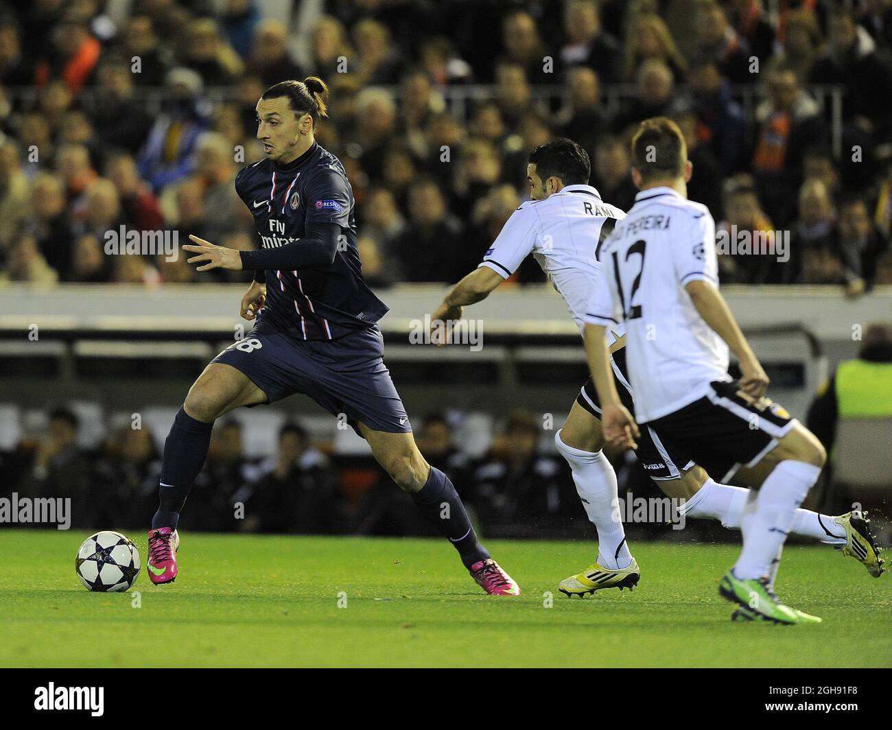 Zlatan Ibrahimovic of Paris Saint Germain goes past Adil Rami of ...