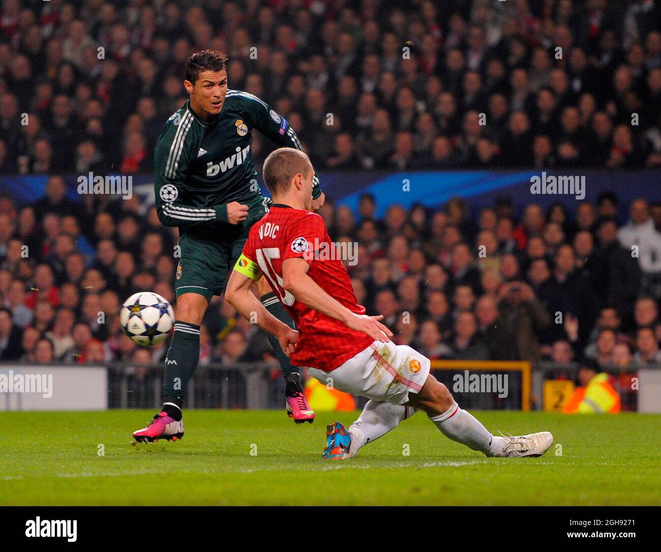 Nemanja Vidic of Manchester United blocks a shot from Cristiano Ronaldo ...