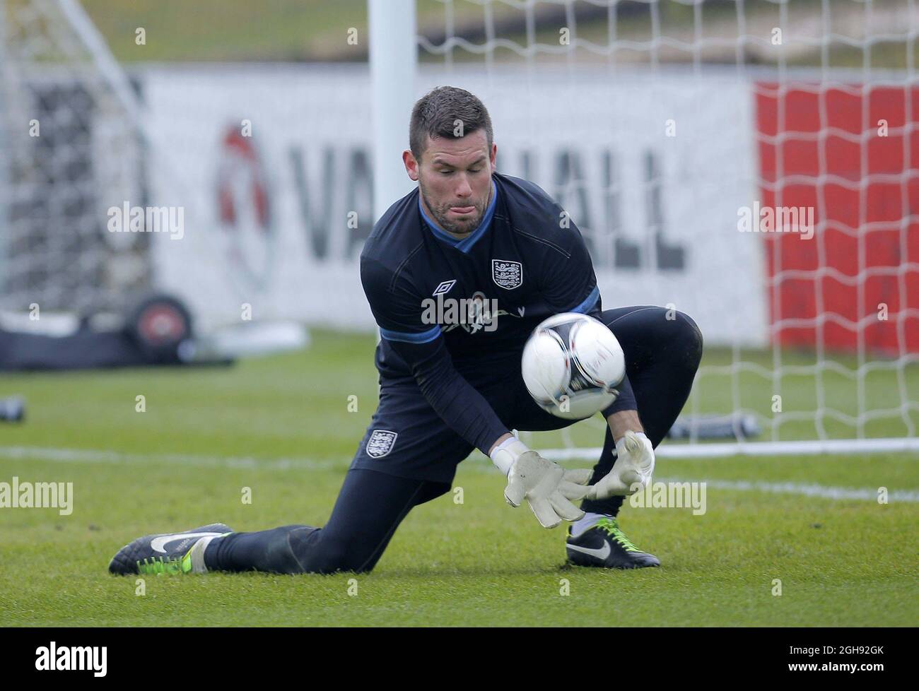 Goalkeeper Ben Foster warms up during England training at St Georges ...