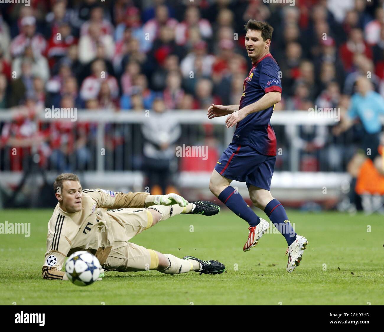 Munich's Manuel Neuer watches Barcelona's Lionel Messi's shot goes wide ...
