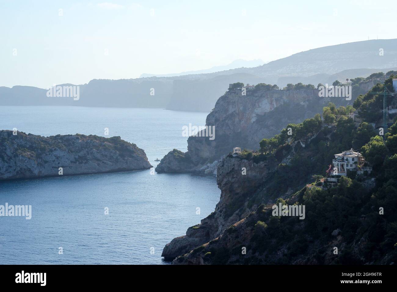 Spanish mainland cliffs with villas Stock Photo - Alamy