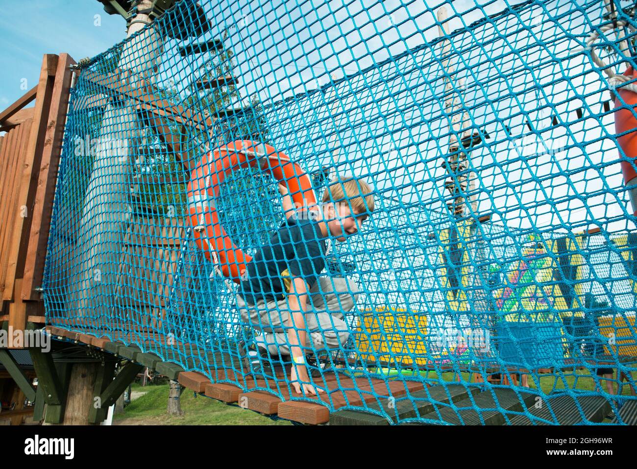 Seven year old boy playing at the playground Stock Photo - Alamy