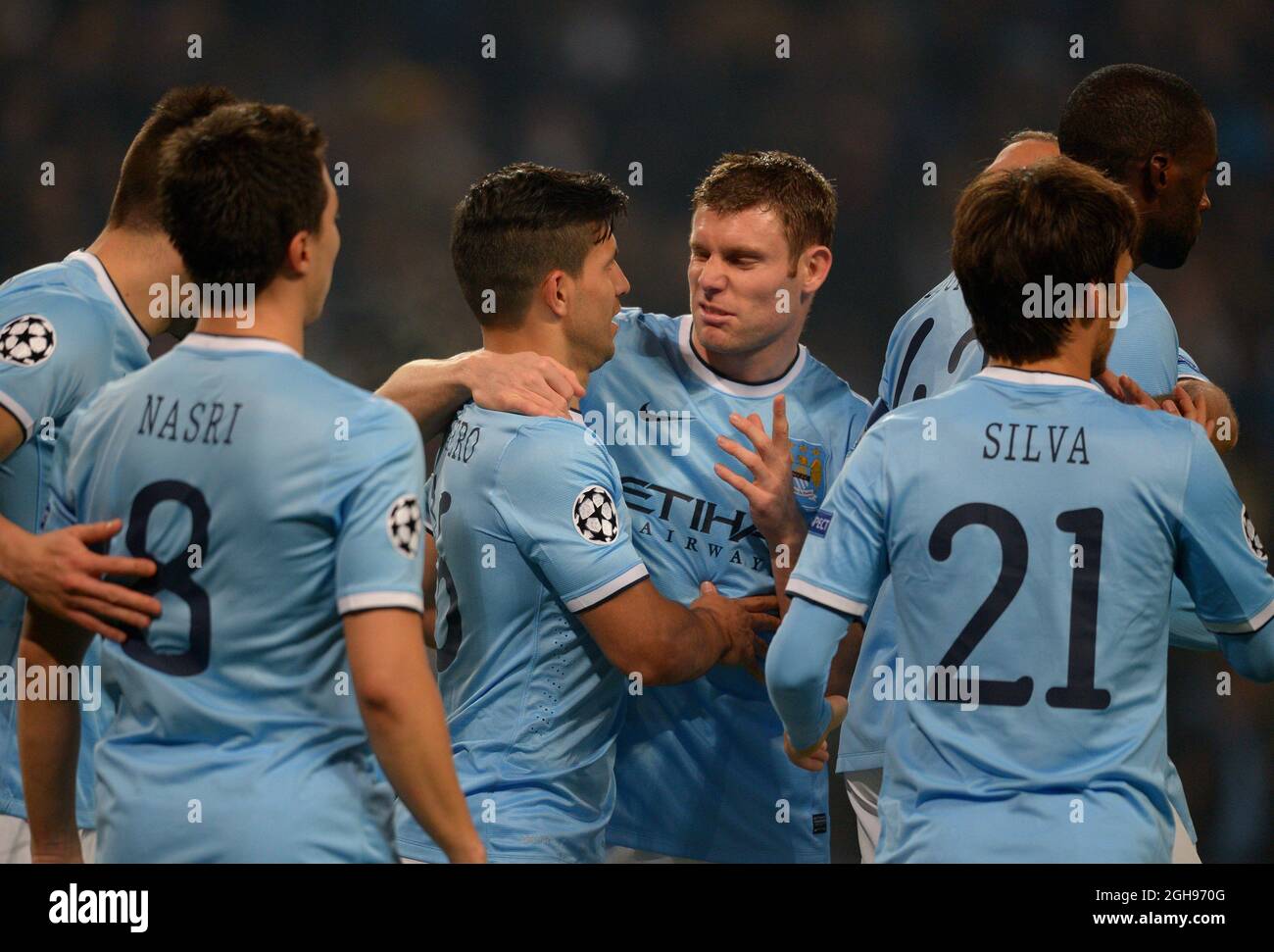 James Milner of Manchester City reacts with Sergio Aguero of Manchester ...