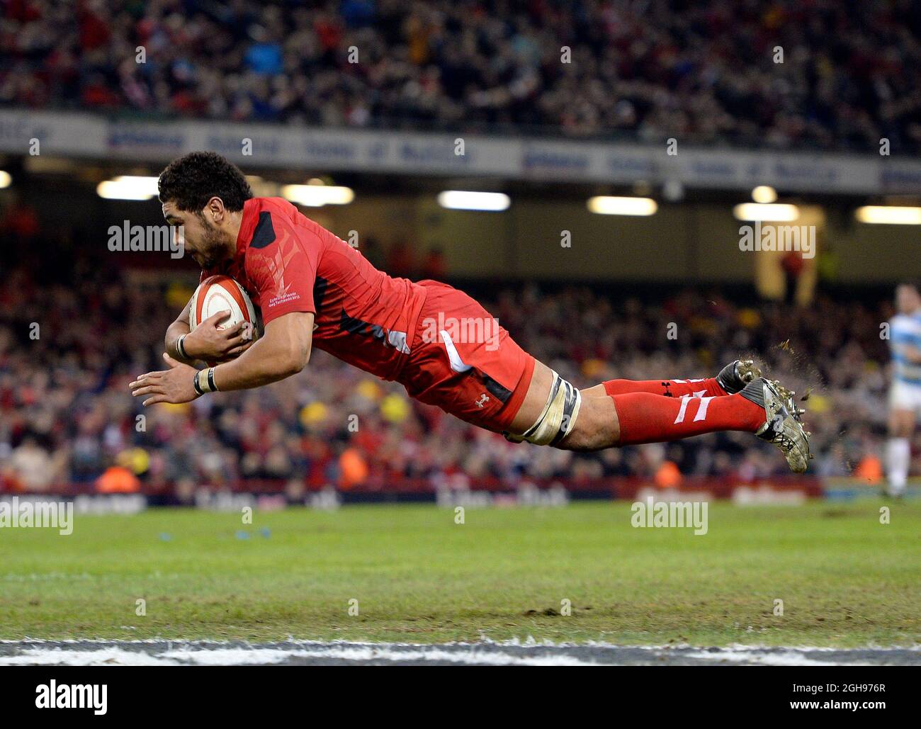 Toby Faletau of Wales dives over to score a try during the rugby union ...