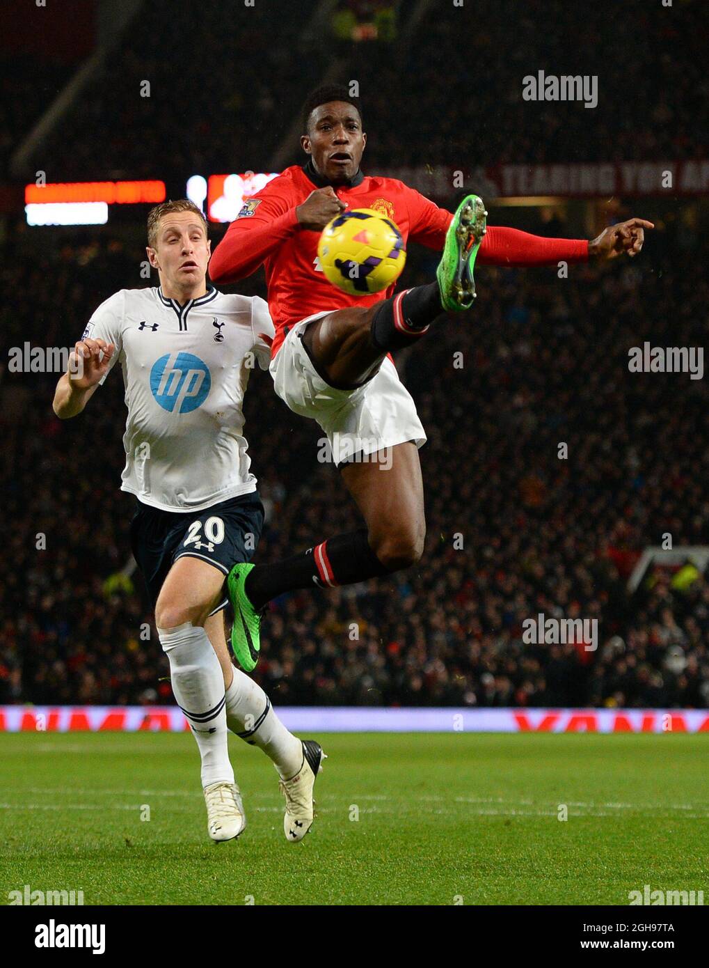 Danny Welbeck of Manchester United flicks the ball past Michael Dawson ...