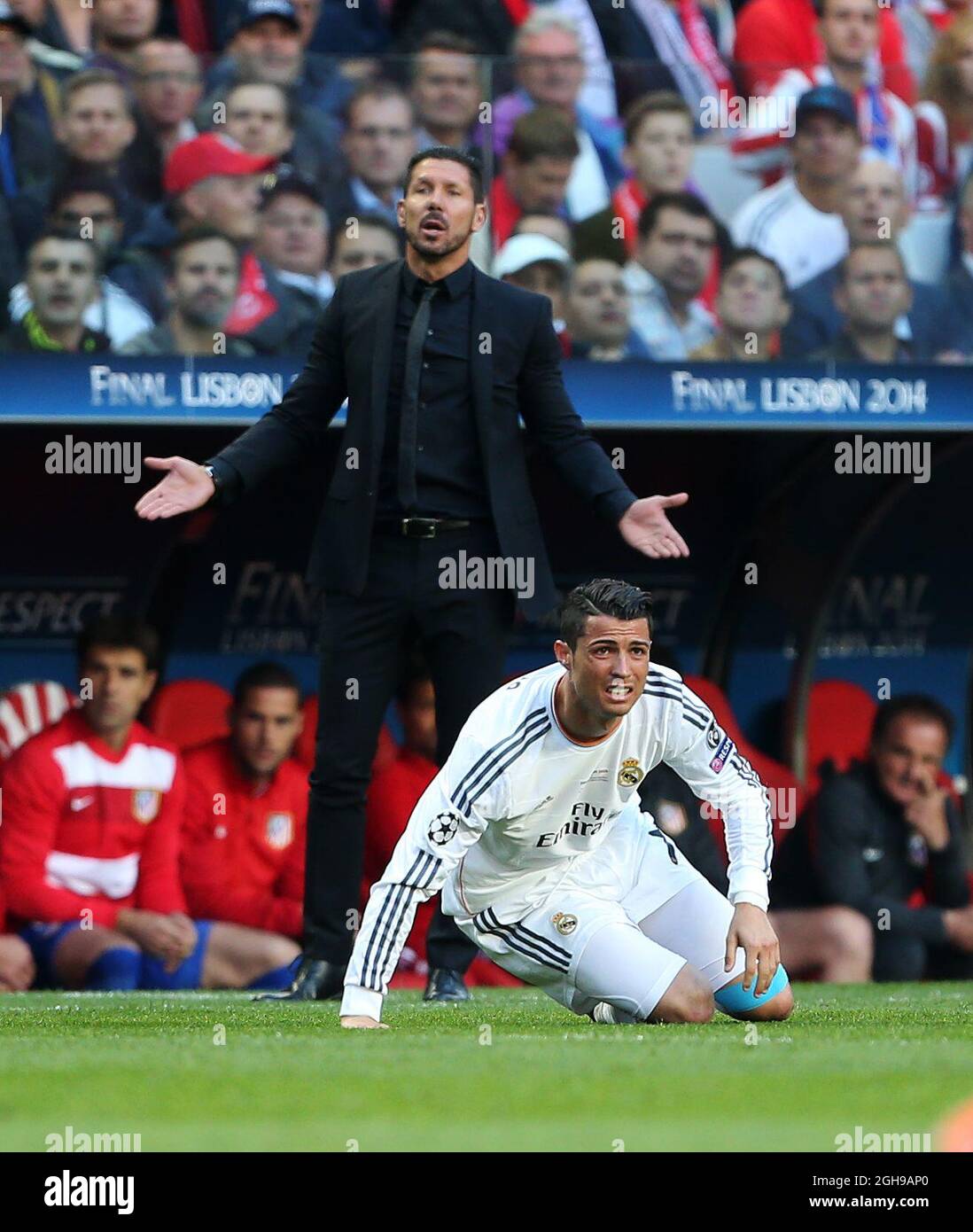 Real Madrid's Cristiano Ronaldo gets fouled as Atletico Madrids Diego ...