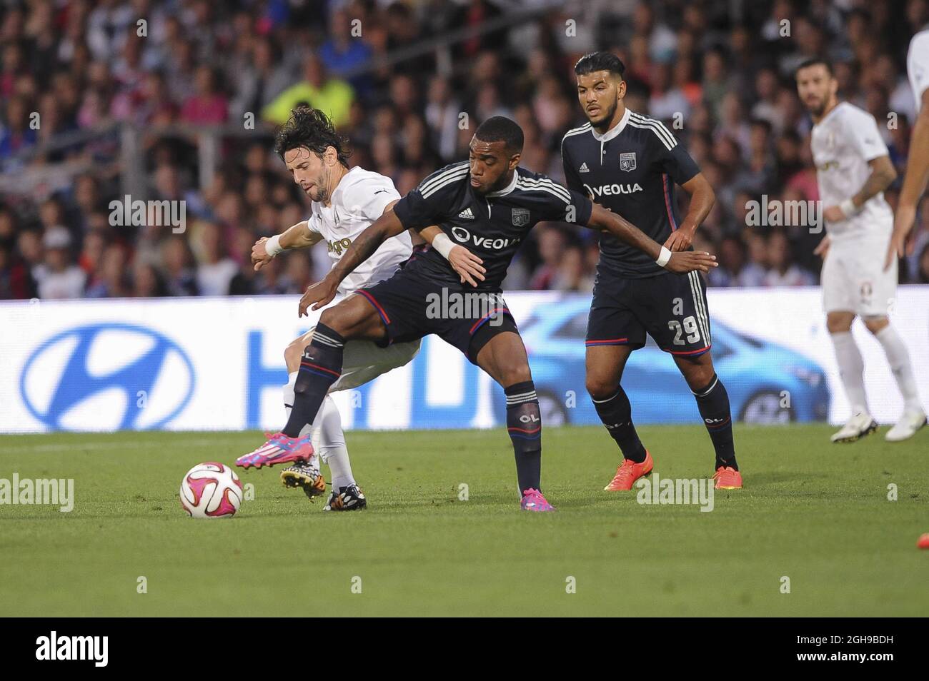 Vincent Laban and Alexandre Lacazette in action during the UEFA Europa ...