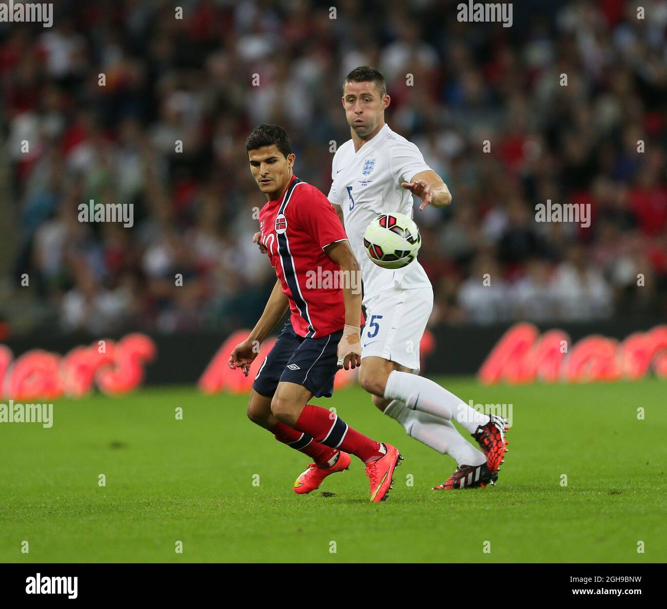 England's Gary Cahill tussles with Norway's Tarik El Younoussi during the International Friendly ...