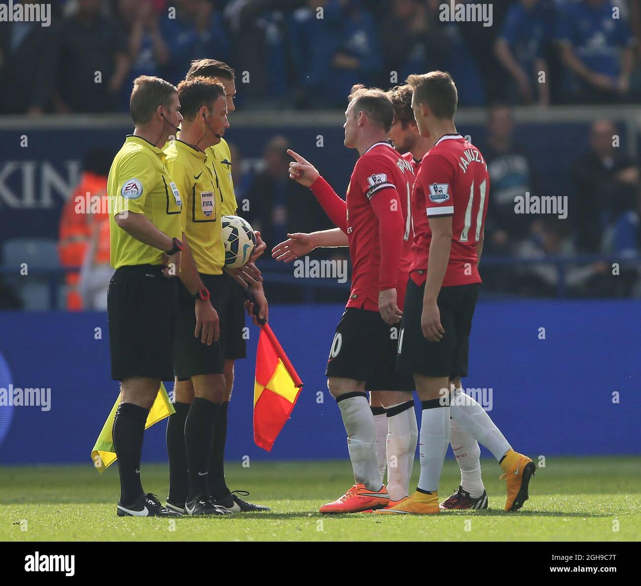 Wayne Rooney of Manchester United points finger at referee Mark ...