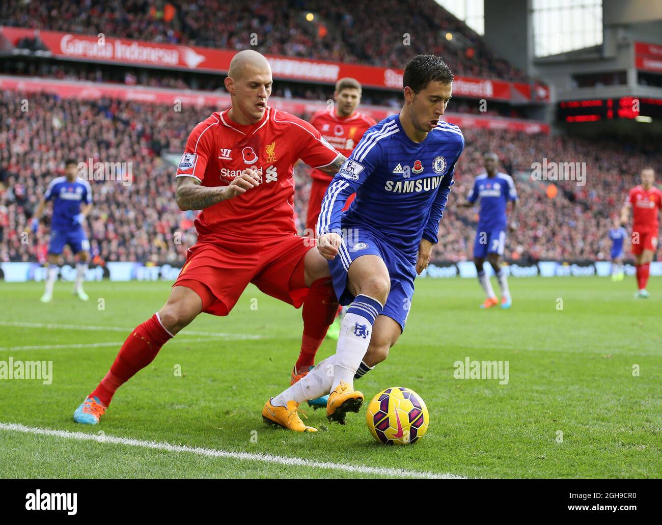 Eden Hazard of Chelsea holds off Martin Skrtel of Liverpool during the ...