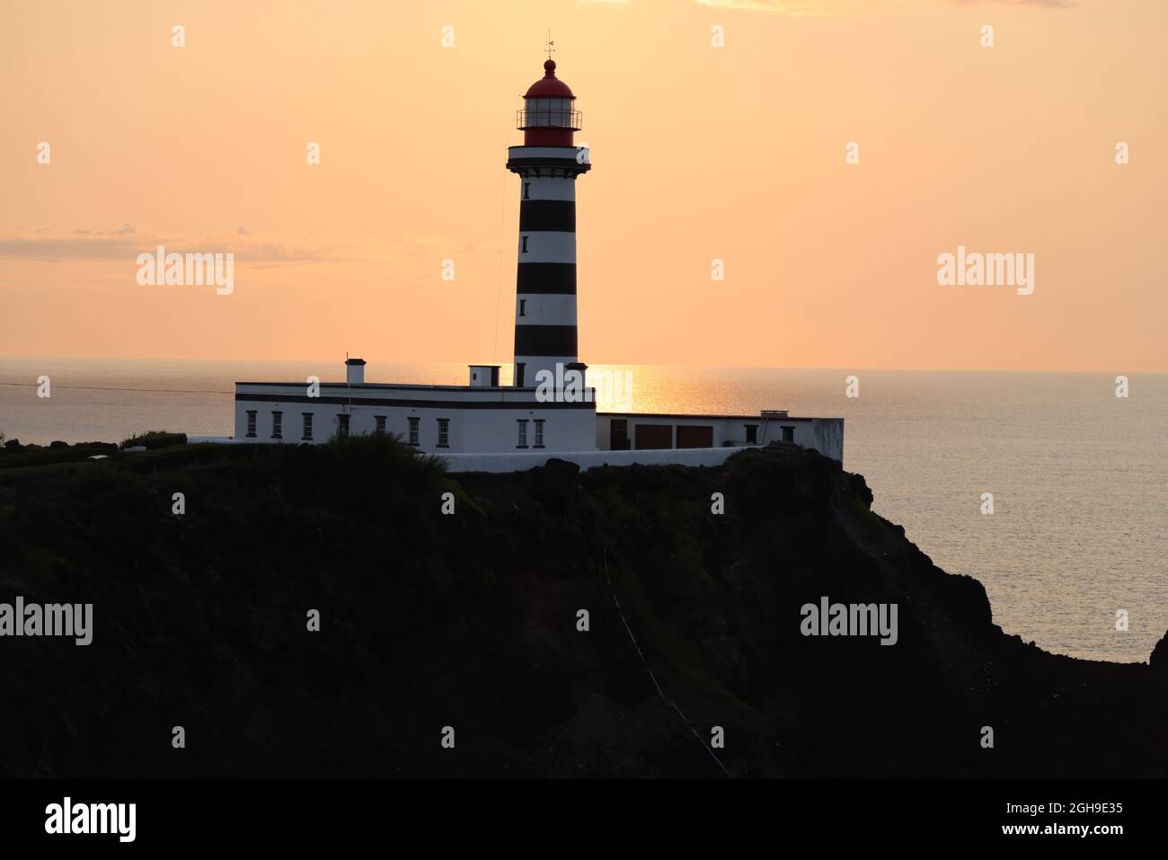 Sunset at the lighthouse of Ponta da Barca, Graciosa island, Azores ...