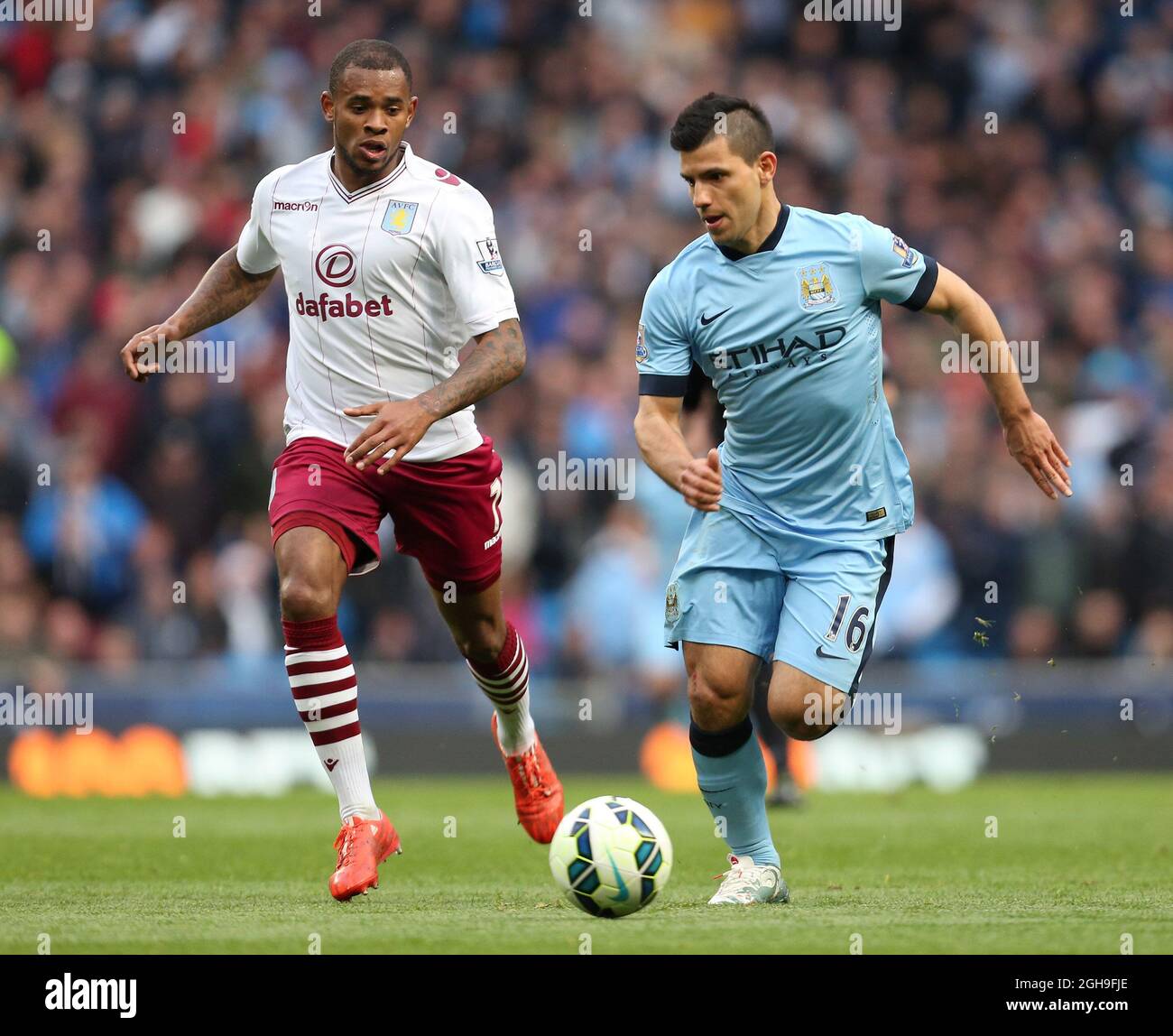 Leandro Bacuna of Aston Villa pressures Sergio Aguero of Manchester ...