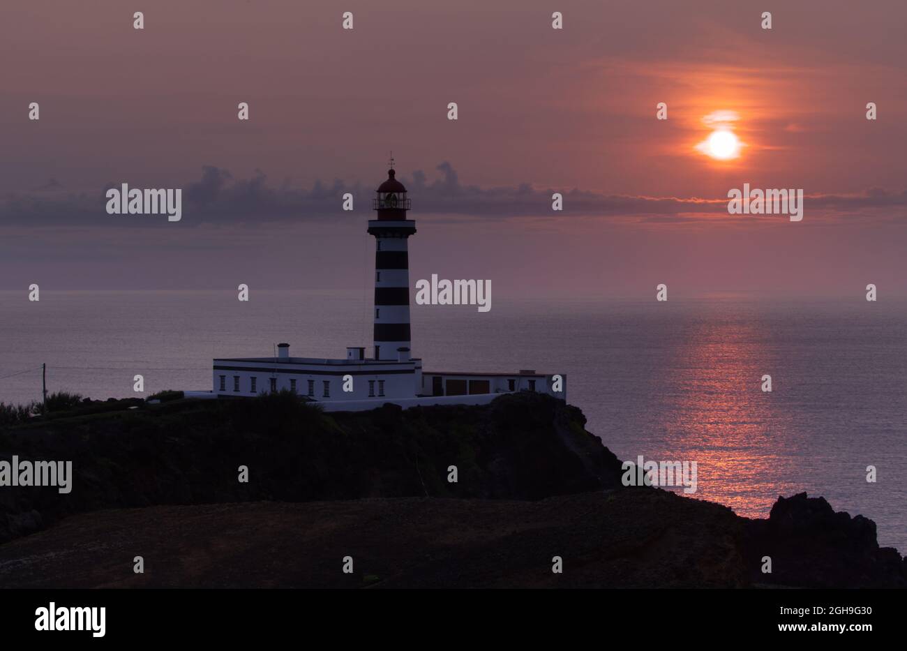 Sunset at the lighthouse of Ponta da Barca, Graciosa island, Azores Stock Photo - Alamy