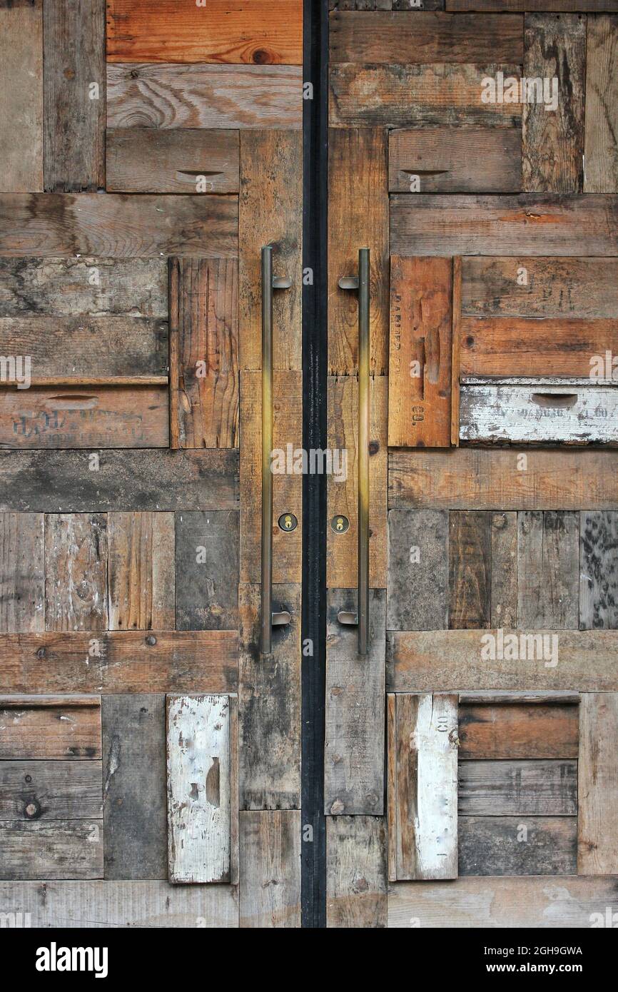 Heavy rustic wooden door made out of huge wood planks Stock Photo - Alamy