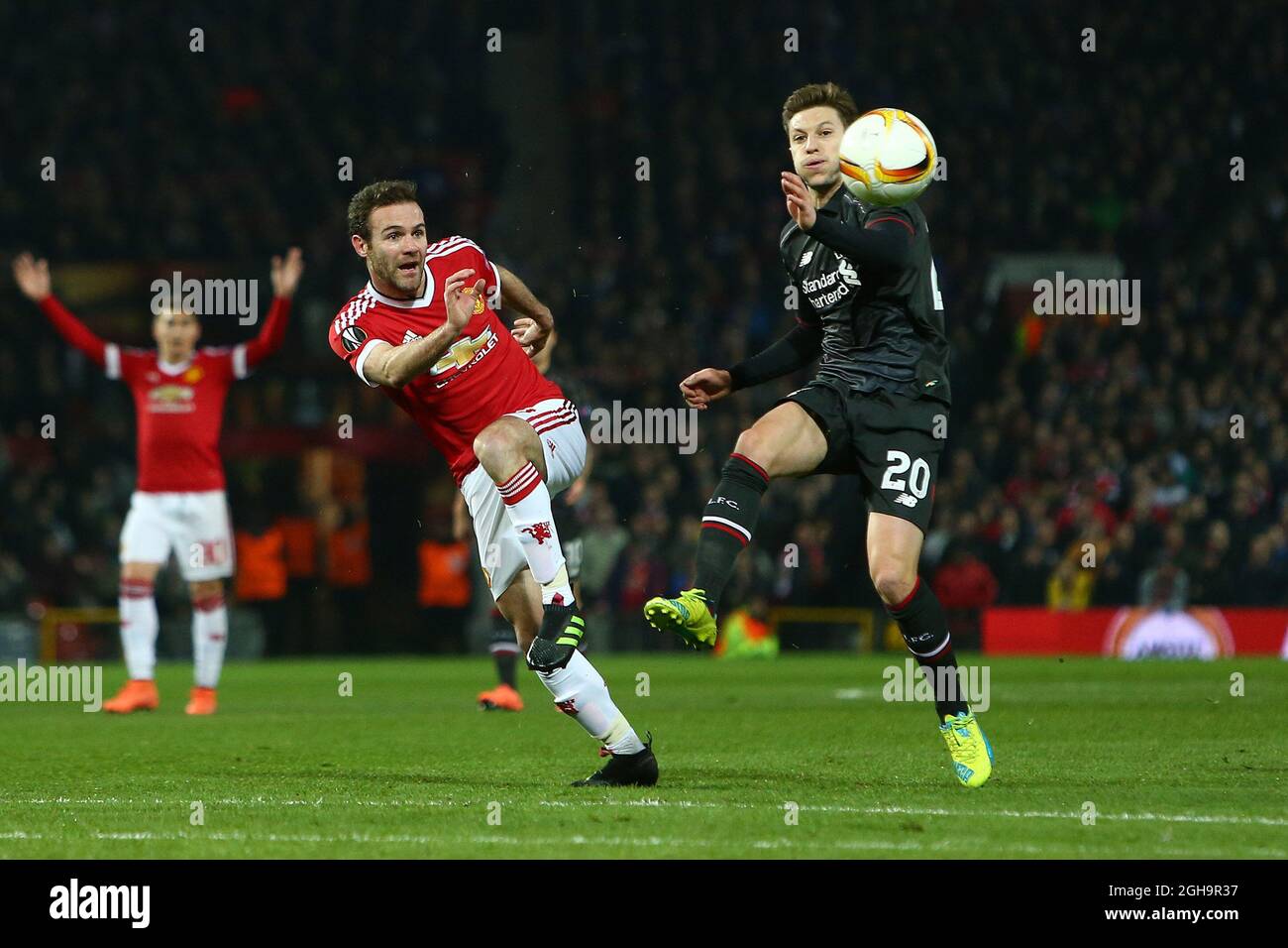 Juan Mata of Manchester United and Adam Lallana of Liverpool during the ...