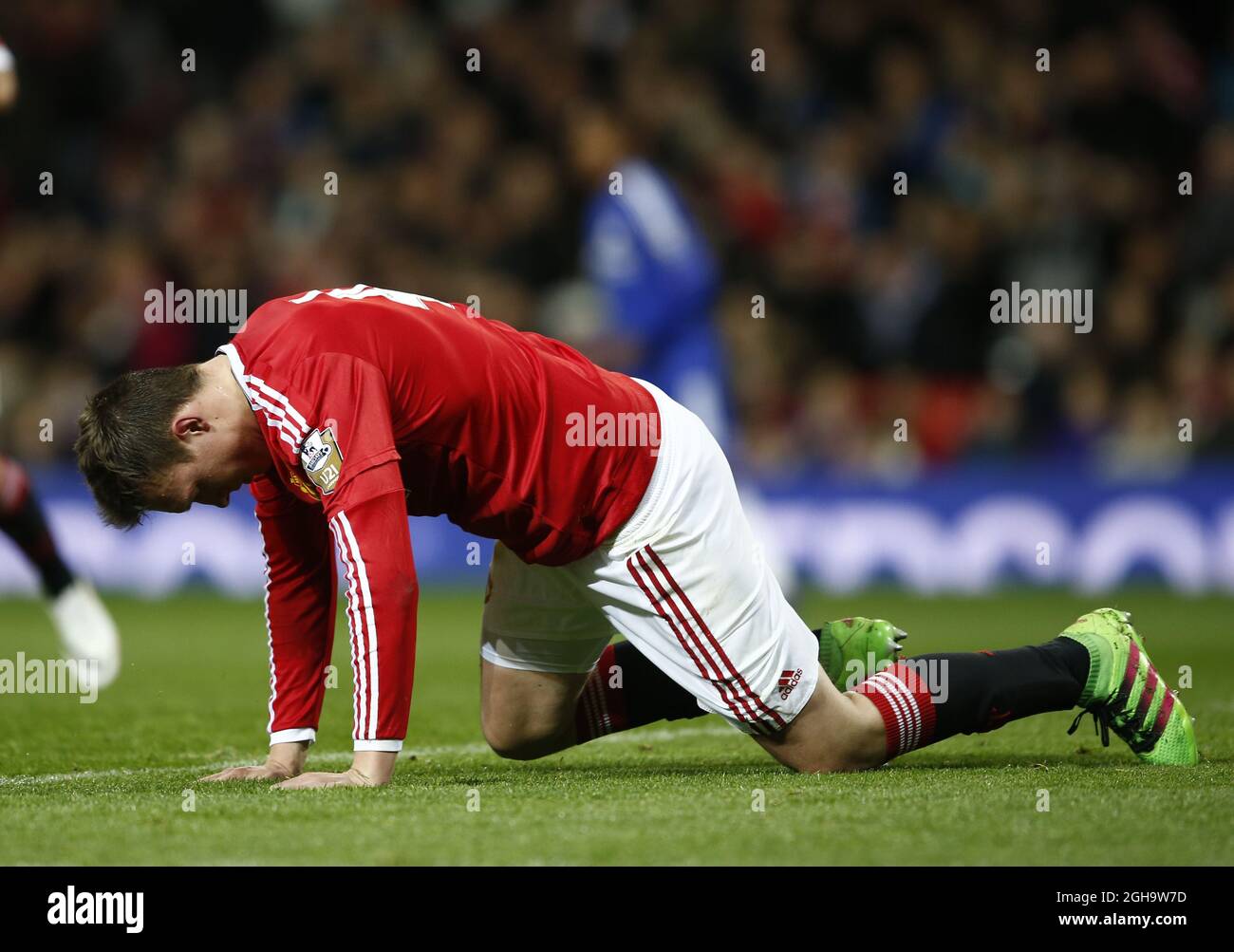 Phil Jones of Manchester United takes his time getting back on his feet ...