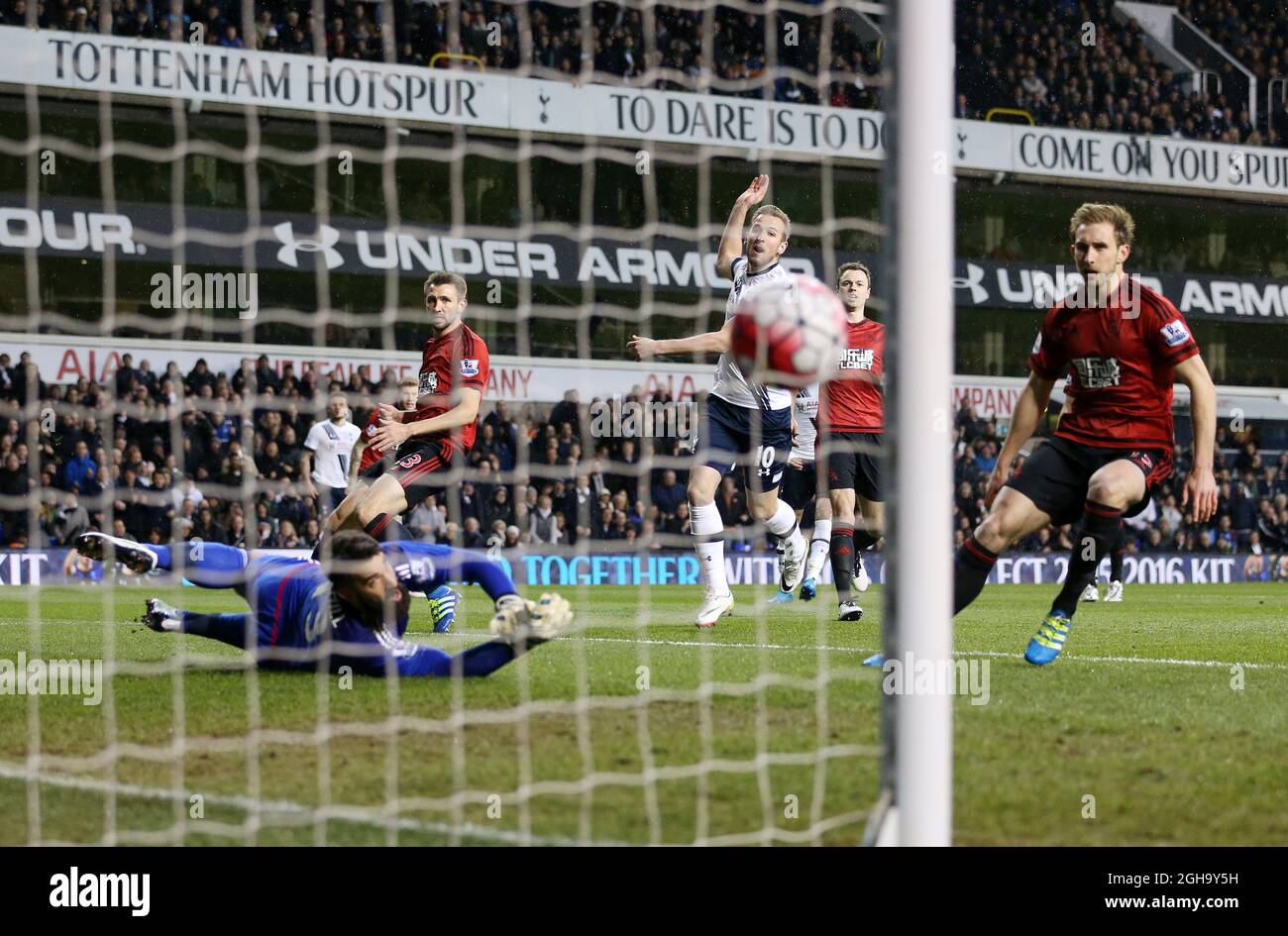 Tottenham's Harry Kane watches as his shot hits the post during the ...