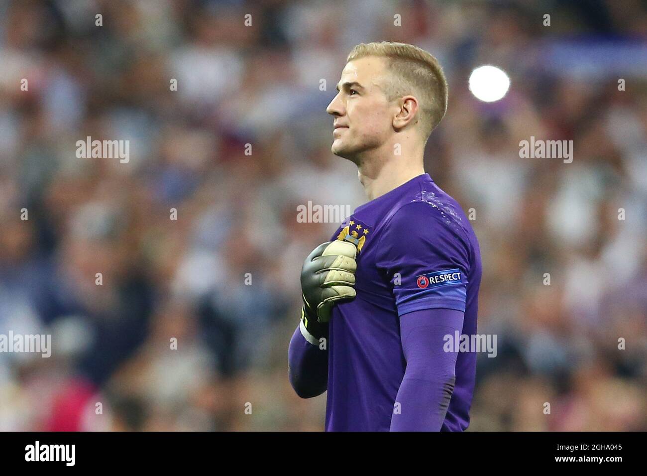 Joe Hart of Manchester City holds the club crest on his shirt during ...
